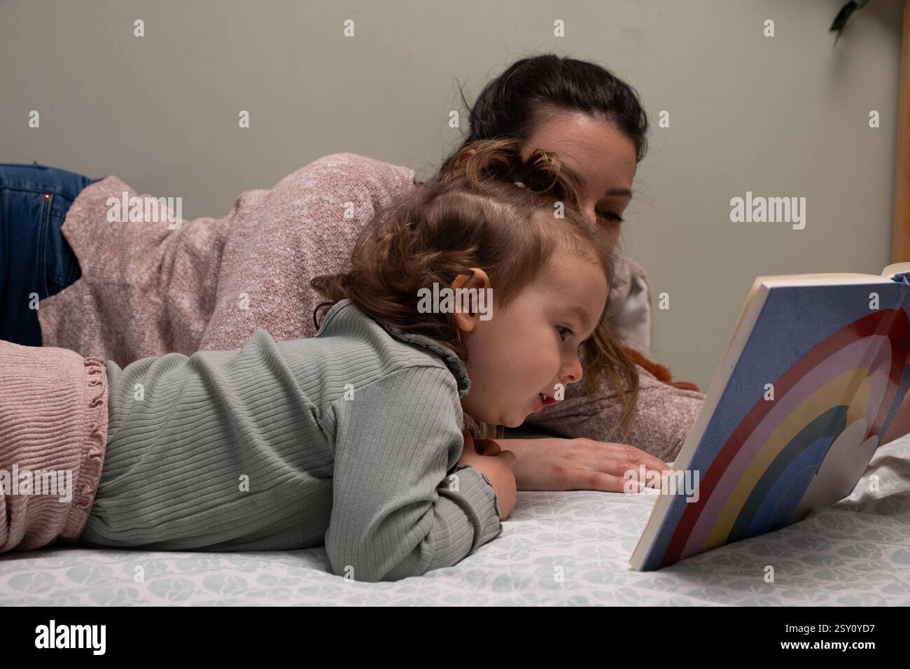 A Special Storytime Moment Between Mom and Daughter Stock Photo - Alamy