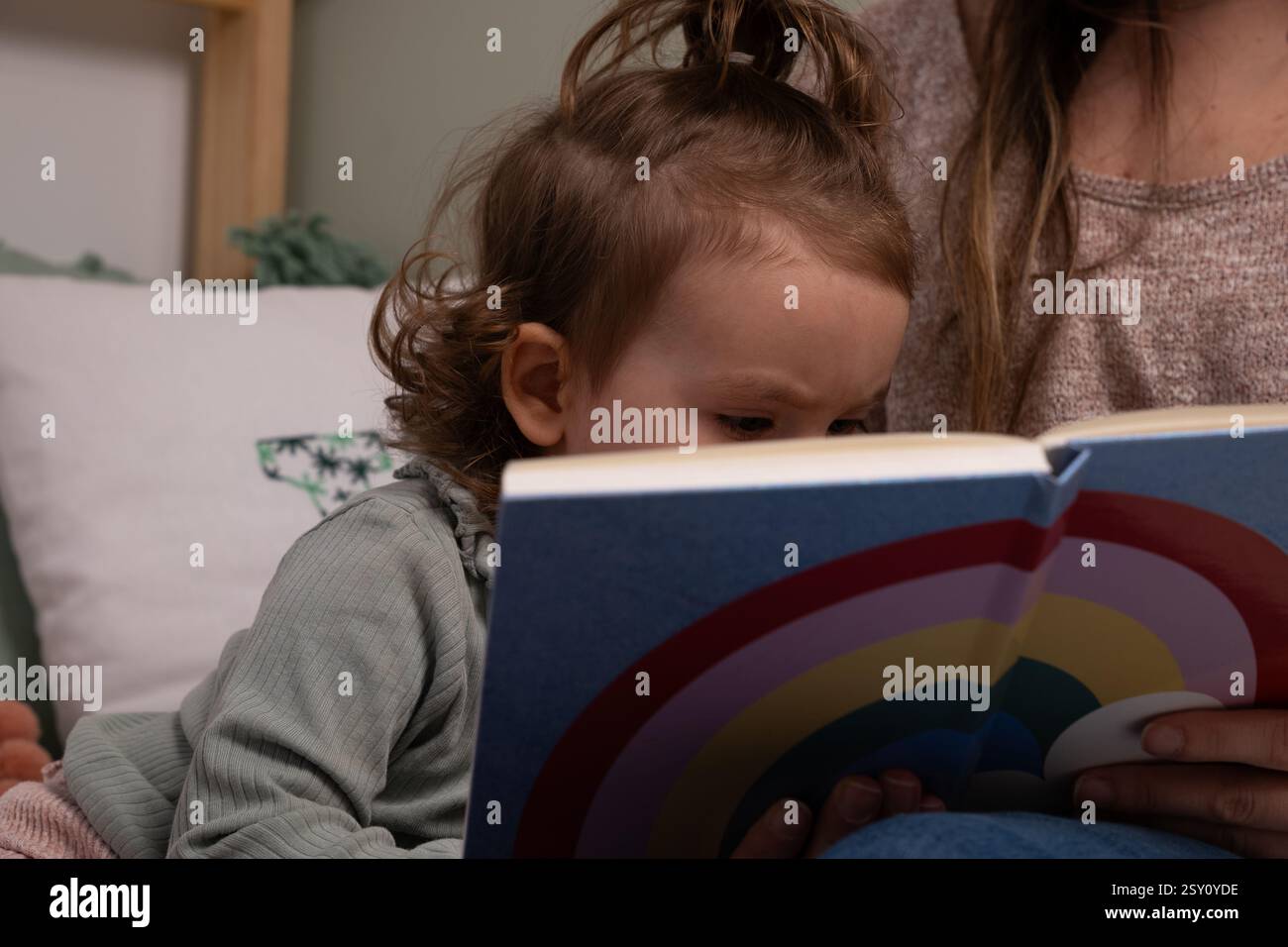 A Special Storytime Moment Between Mom and Daughter Stock Photo - Alamy