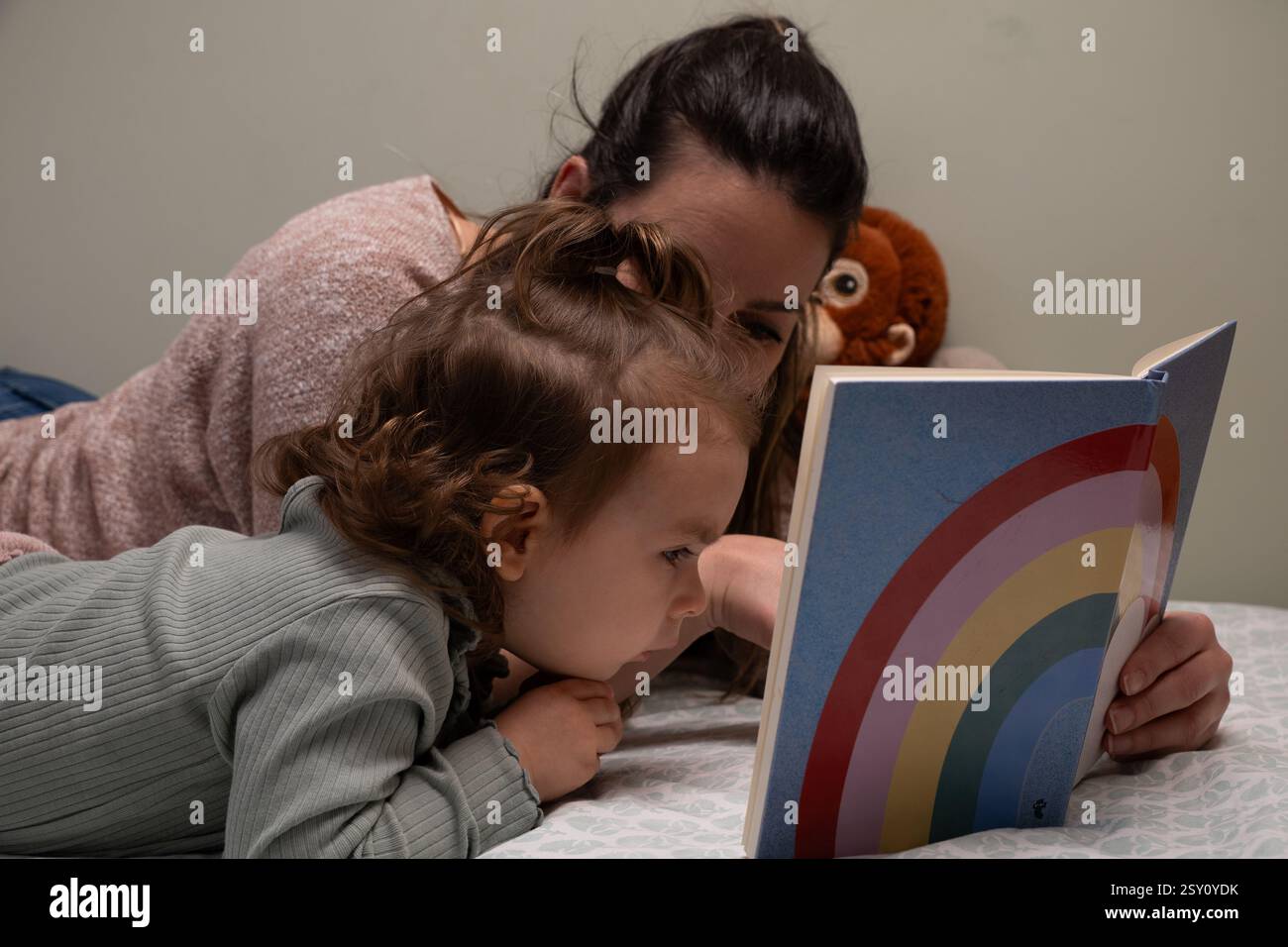 A Special Storytime Moment Between Mom and Daughter Stock Photo - Alamy