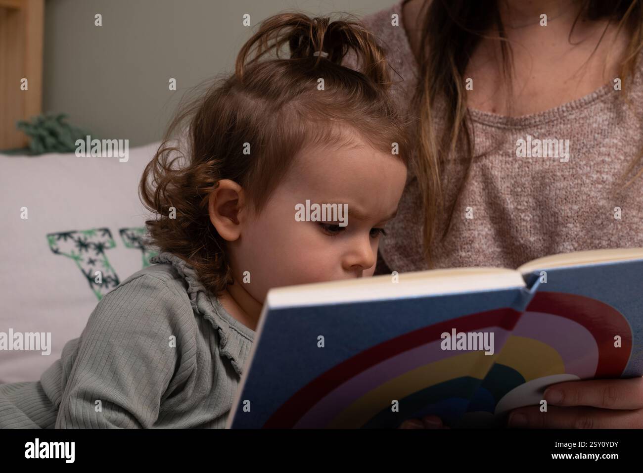 A Special Storytime Moment Between Mom and Daughter Stock Photo - Alamy
