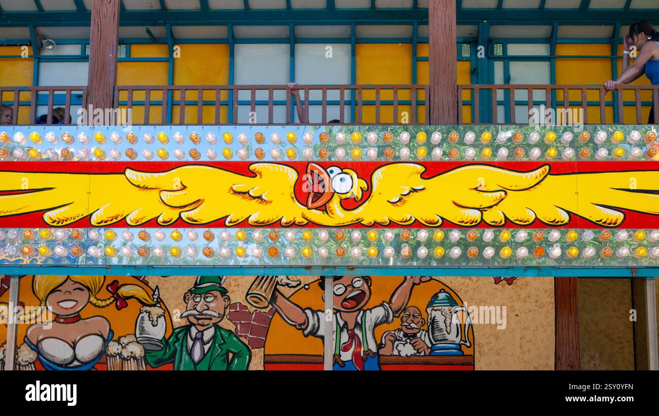 Local carnival signs and rides Stock Photo - Alamy