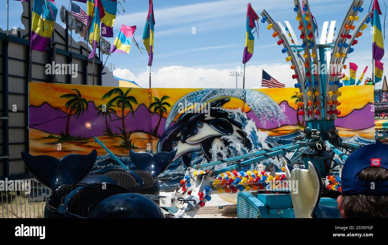 Local carnival signs and rides Stock Photo - Alamy