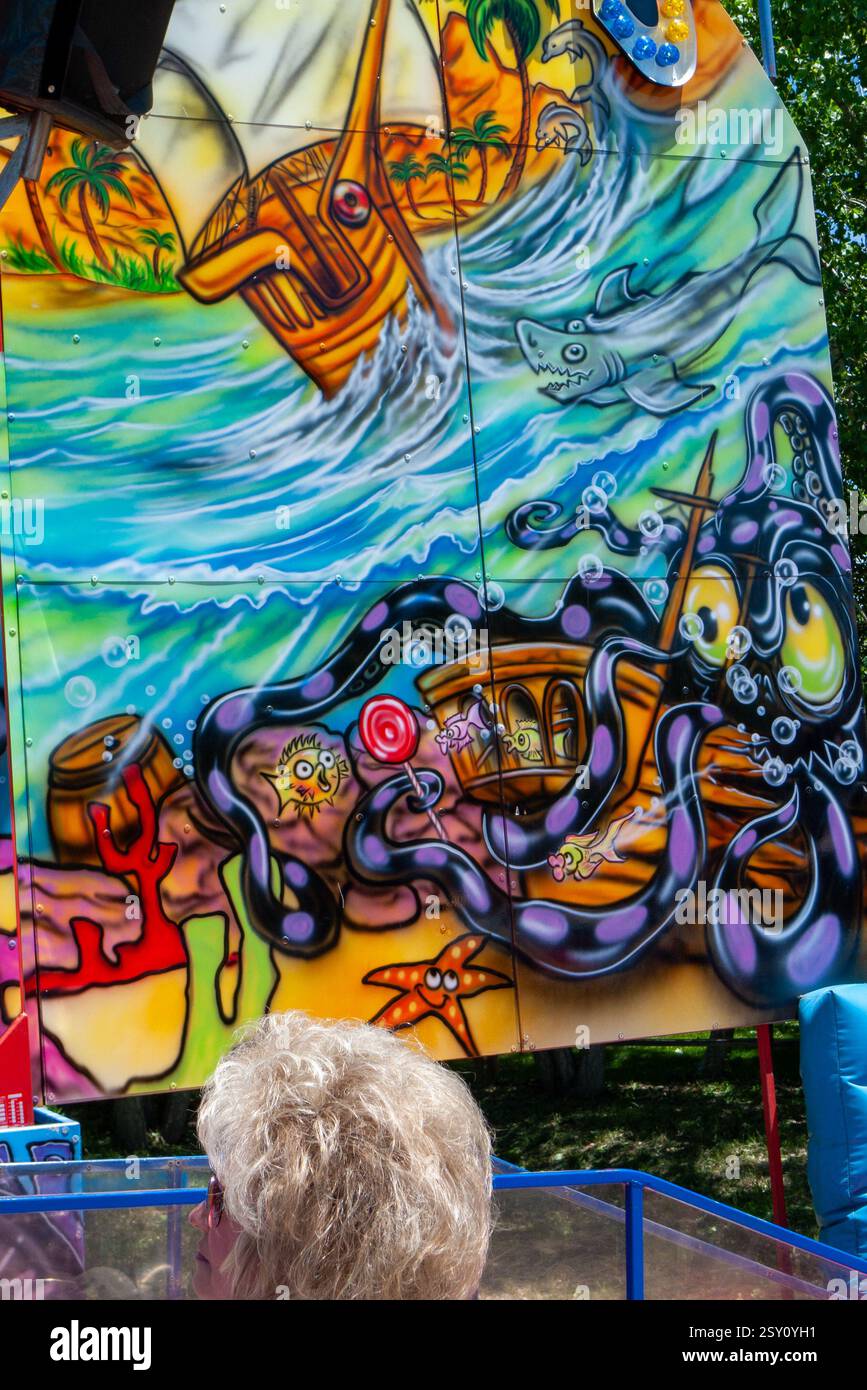 Local carnival signs and rides Stock Photo - Alamy