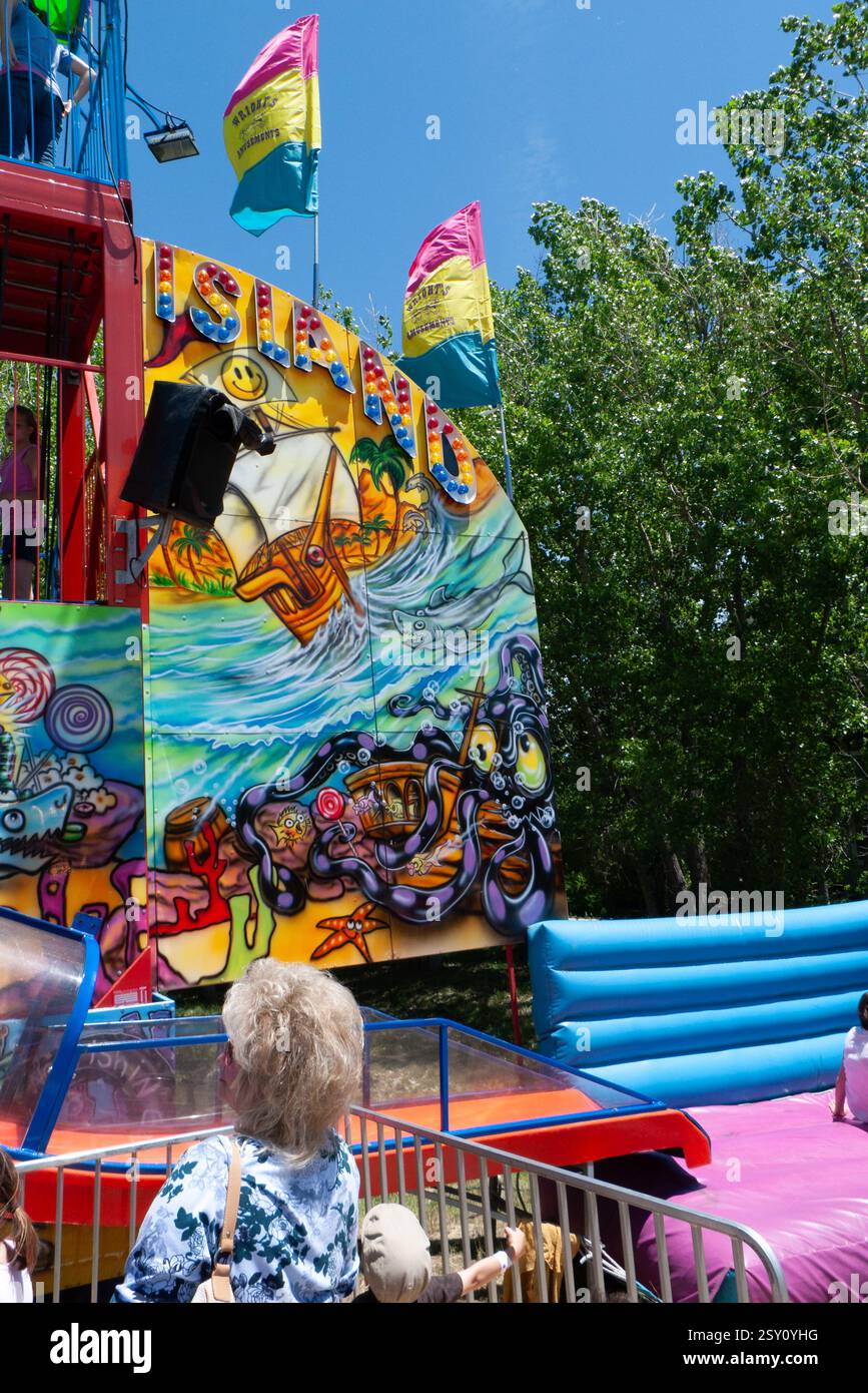 Local carnival signs and rides Stock Photo - Alamy