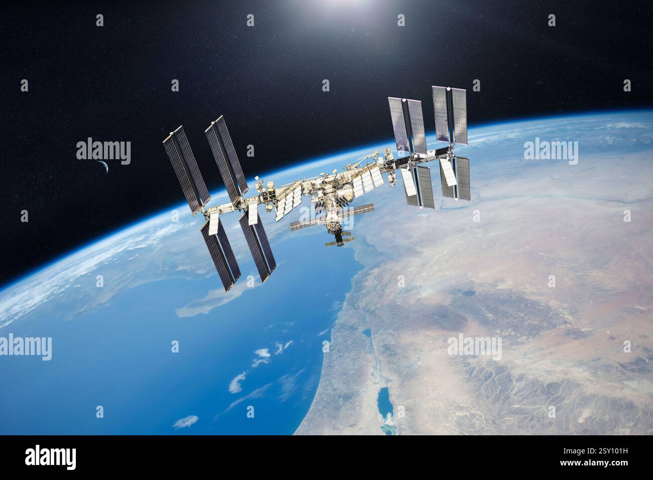 International Space Station on low-orbit of Earth with sun rays ...