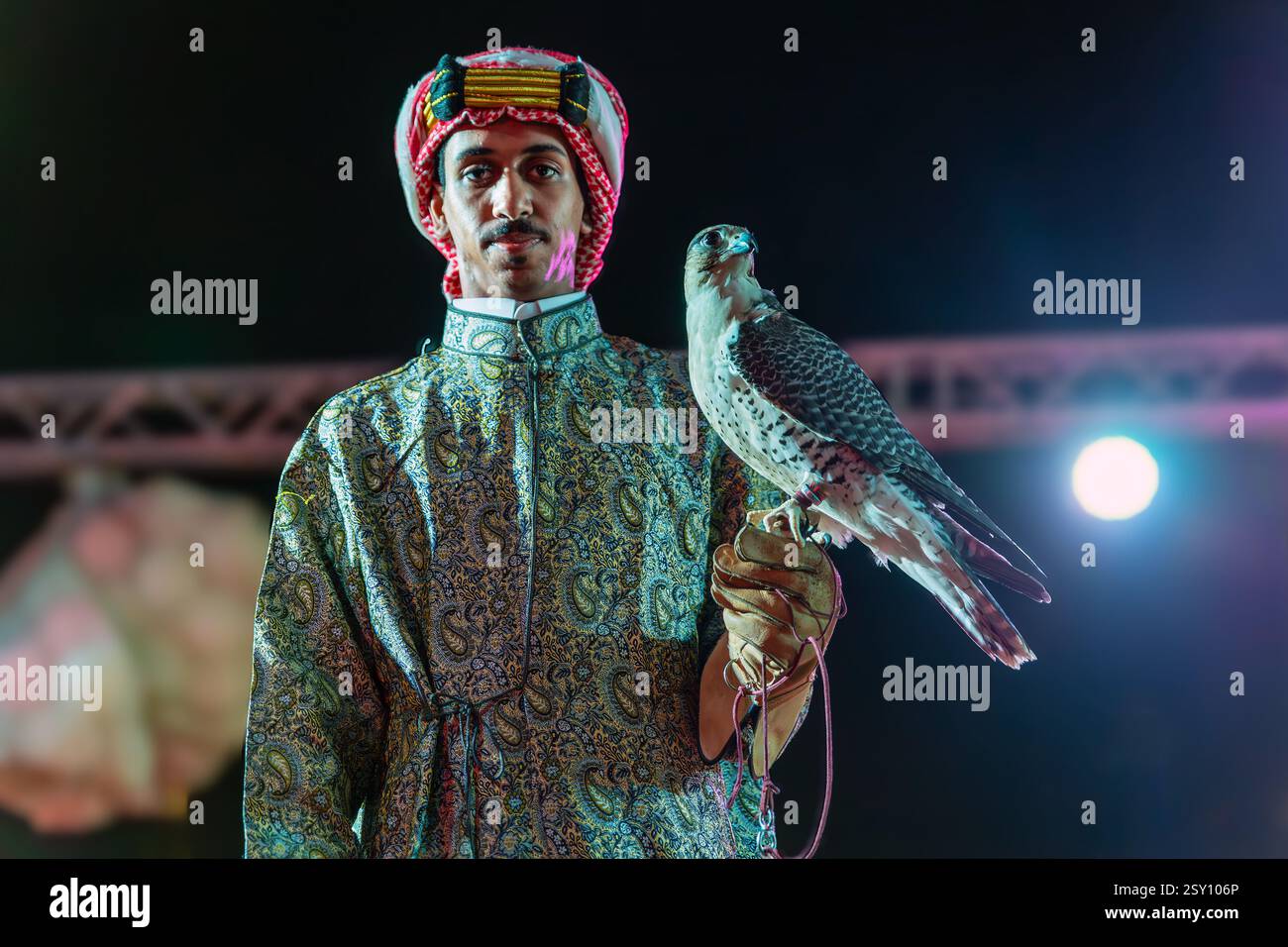 Arabian Man Holding a Falcon on Saudi Foundation Day – A Glimpse into ...