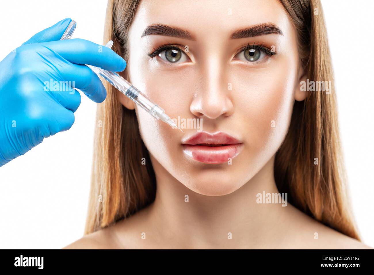 Cosmetologist does injections for lips augmentation anti wrinkle ...