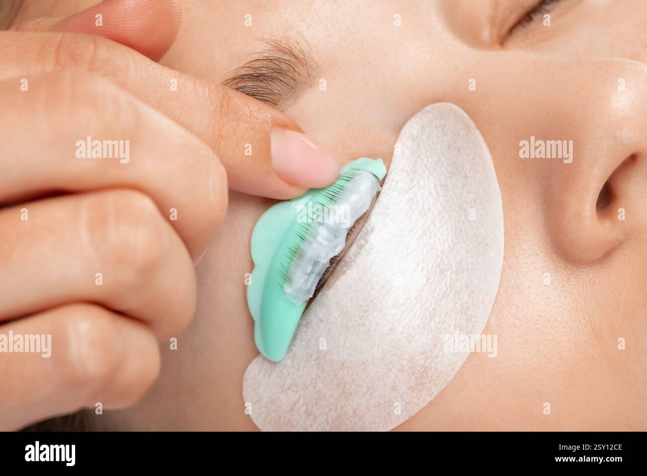 Make-up artist makes the procedure of lamination and dyeing of ...