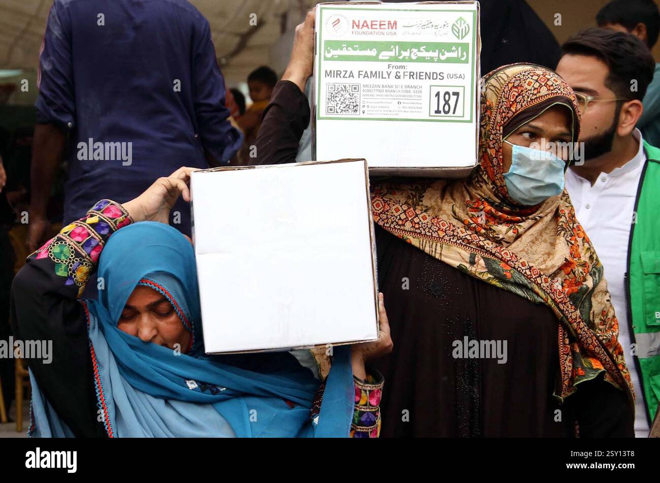 Relief goods is being distributed among needy persons during food aids ...