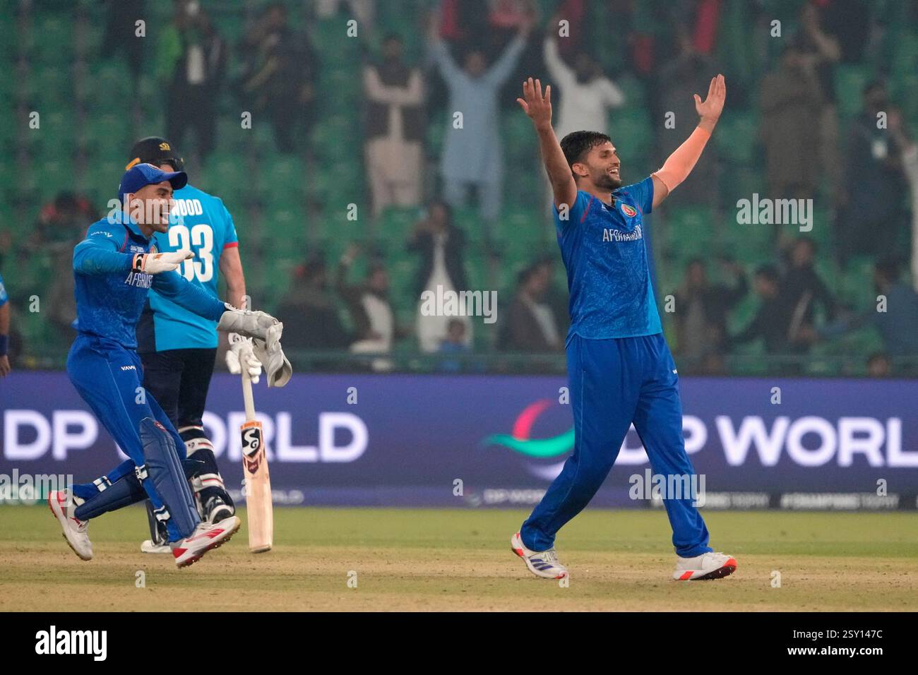 Afghanistan's Azmatullah Omarzai, right, and teammate celebrate after ...