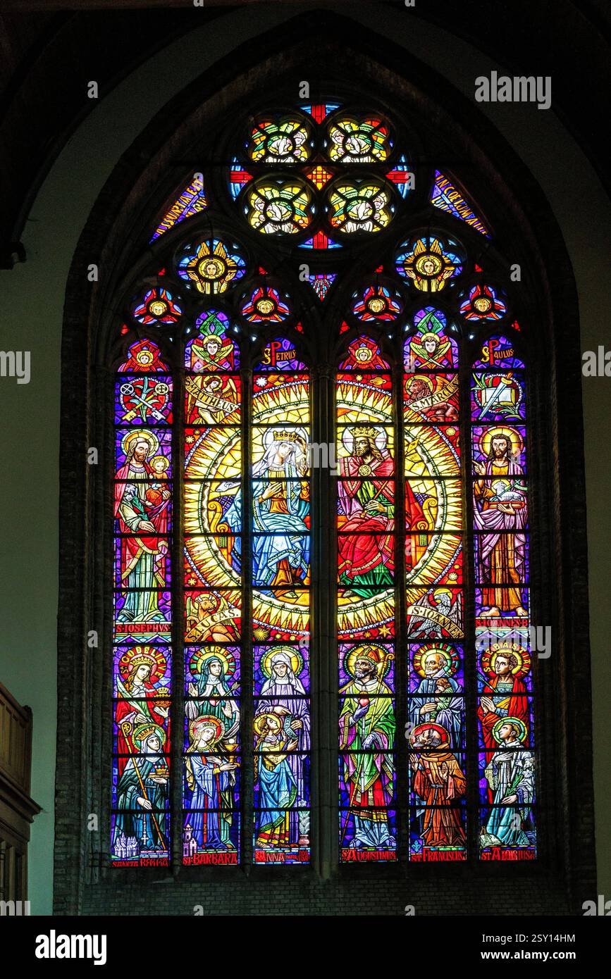 Stained glass window featuring saints, Saint Nicholas church, Diksmuide ...