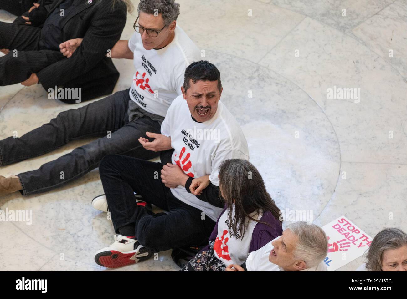 Demonstrators protest the dismantling of USAID at the Cannon House ...