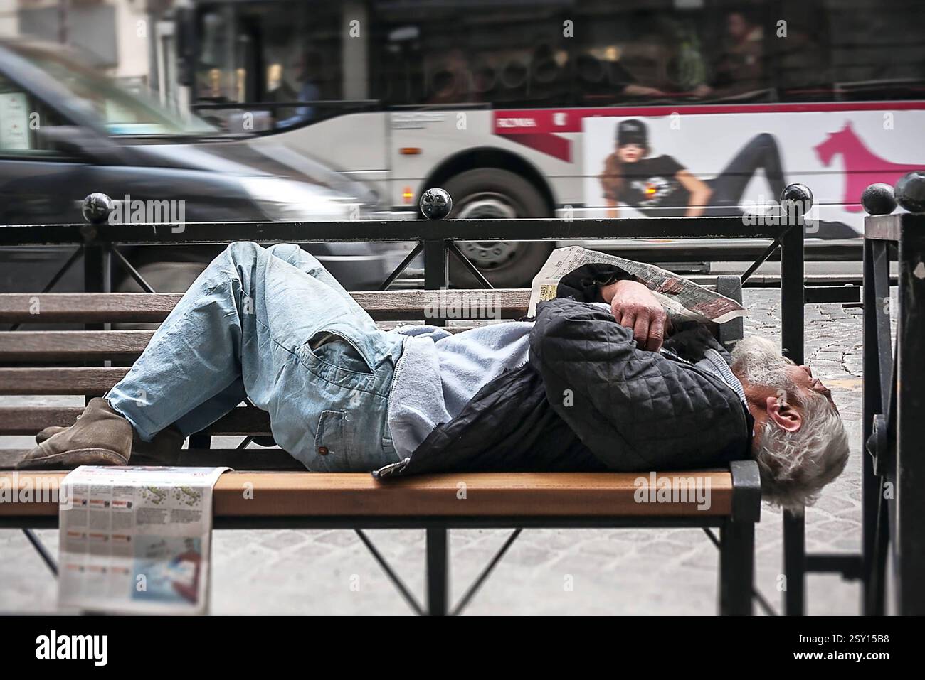 homeless Rome, Italy - April 18, 2008: A homeless man sleeping lying on ...