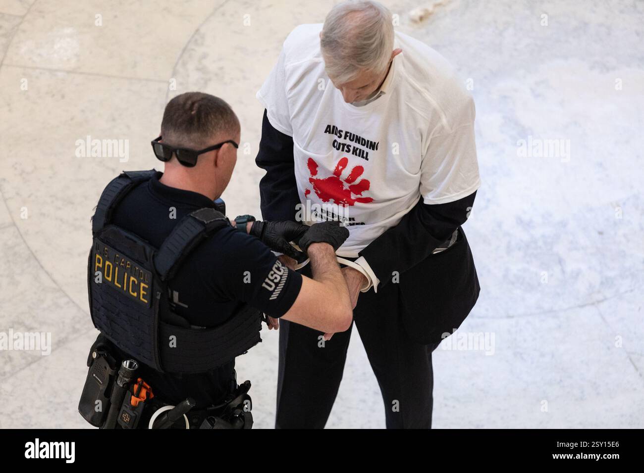 Washington, United States. 26th Feb, 2025. A demonstrator is arrested ...