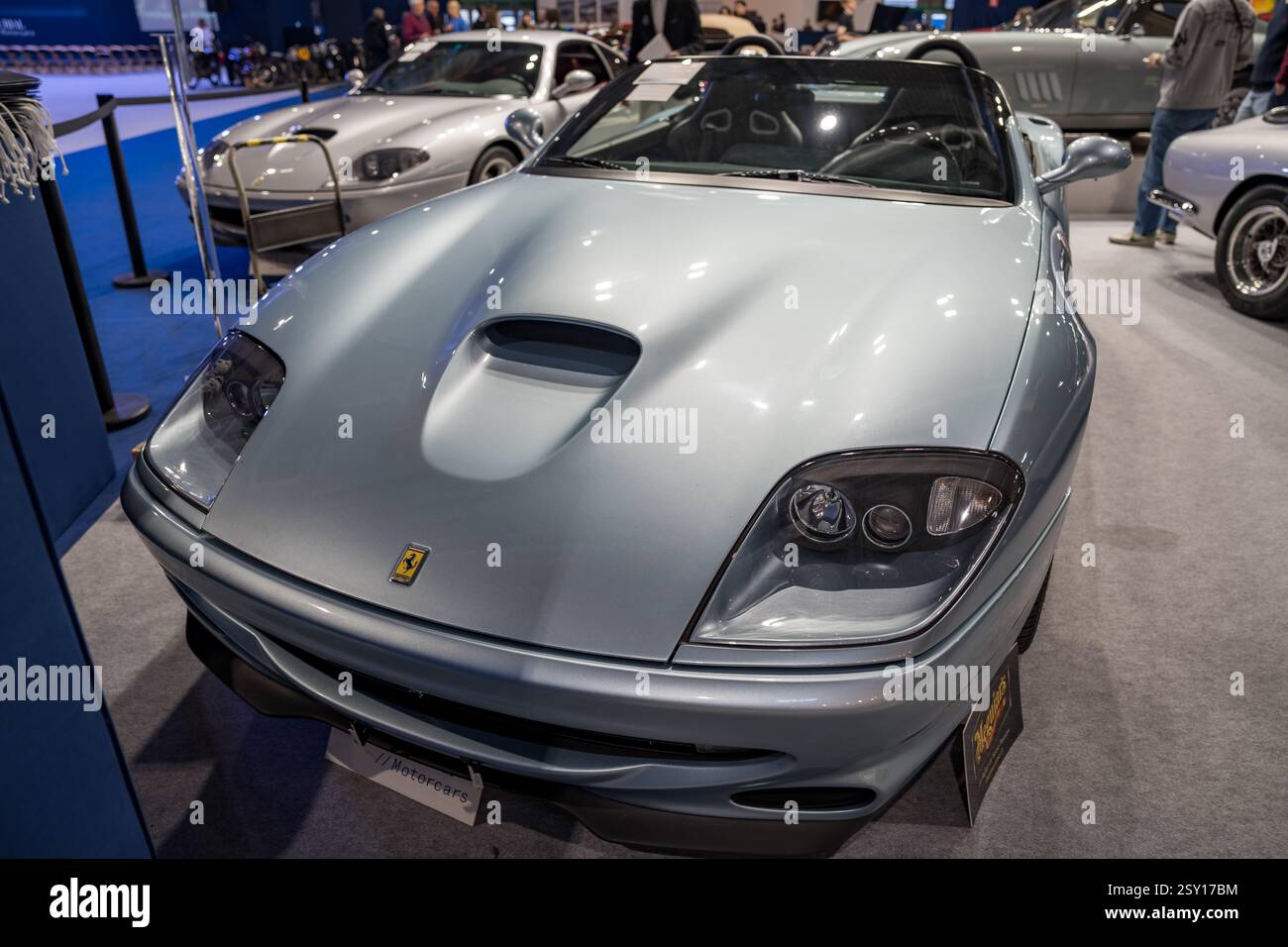 Stunning classic car showcase featuring vintage models at a lively auto ...