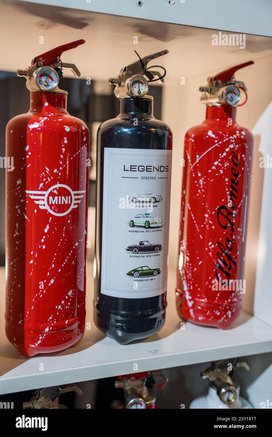 Unique collection of decorative fire extinguishers showcasing car brand ...