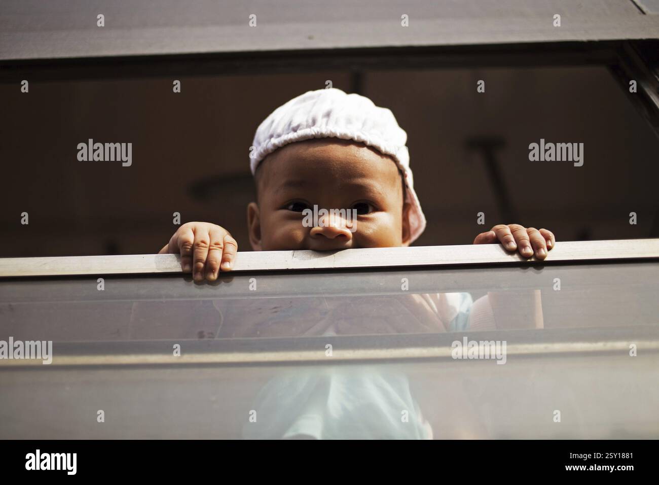 Baby looking out from bus window, cameron highlands, malaysia Stock ...
