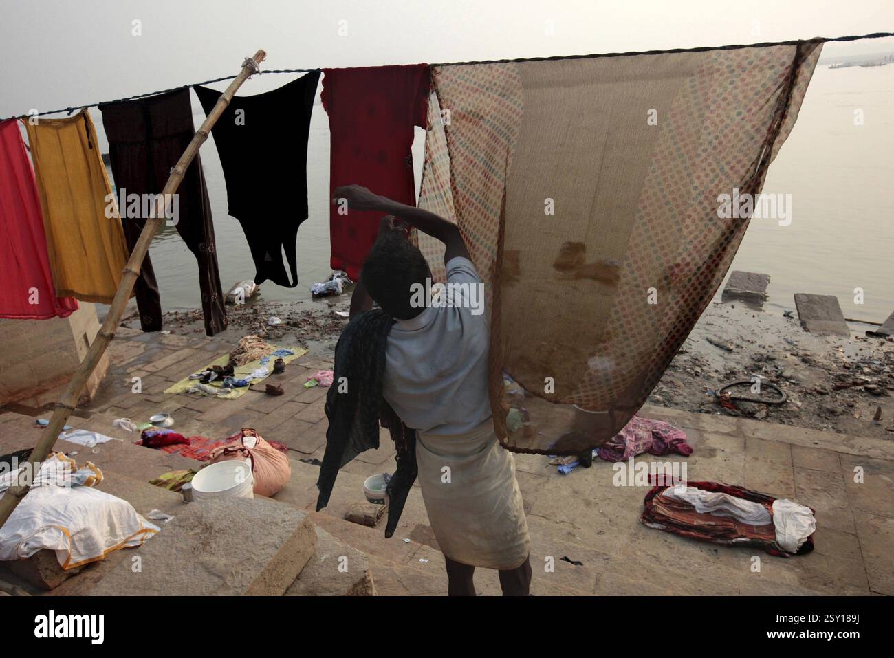 Man drying clothes in Ganga River at Varanasi Uttar Pradesh India Stock ...