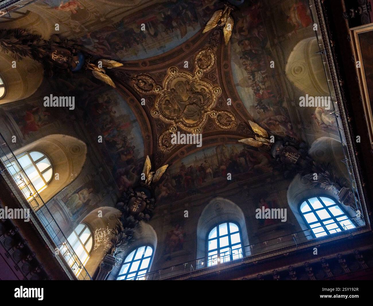Upward view of the elaborately decorated ceiling in the Salon Denon at ...