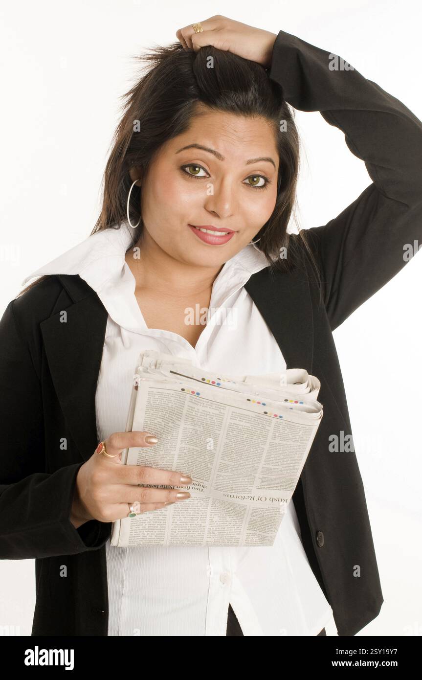 South Indian girl holding newspaper in Pune at Maharashtra India Asia MR#686X Stock Photo - Alamy