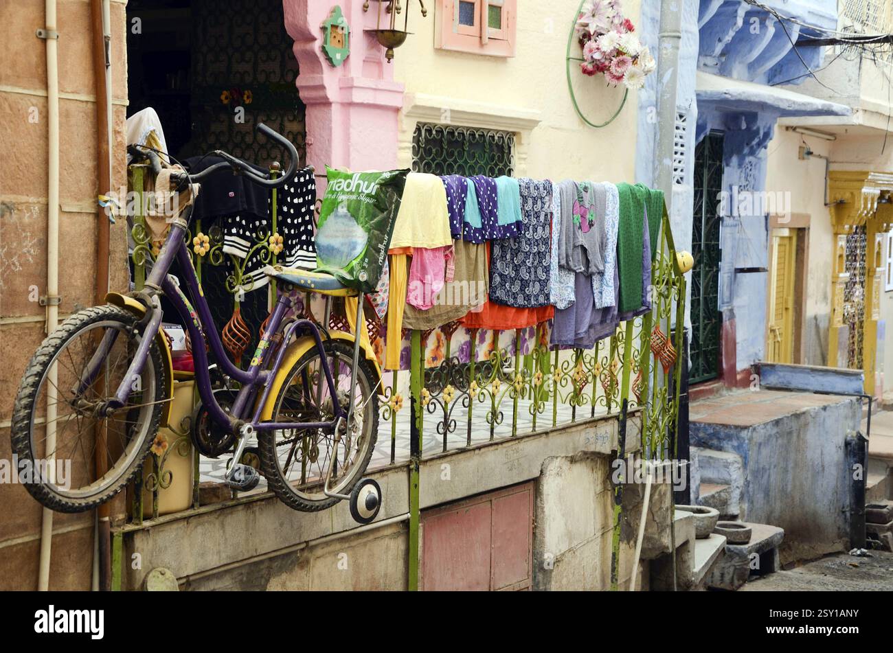 Cycle hanging on railing outside house jodhpur rajasthan India Asia ...