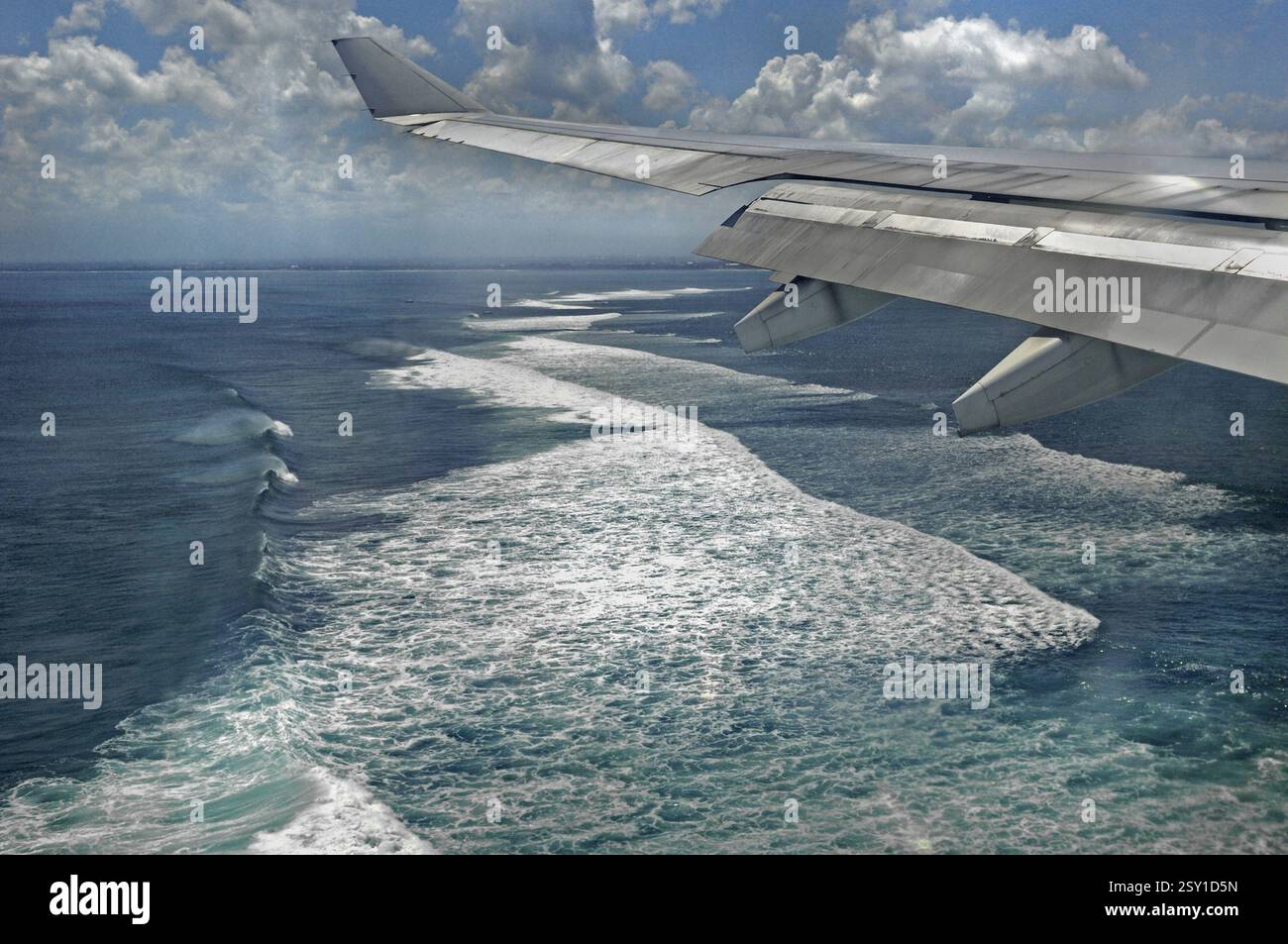 Aerial view of surf, wing with winglet, approach to Denpasar, Bali ...