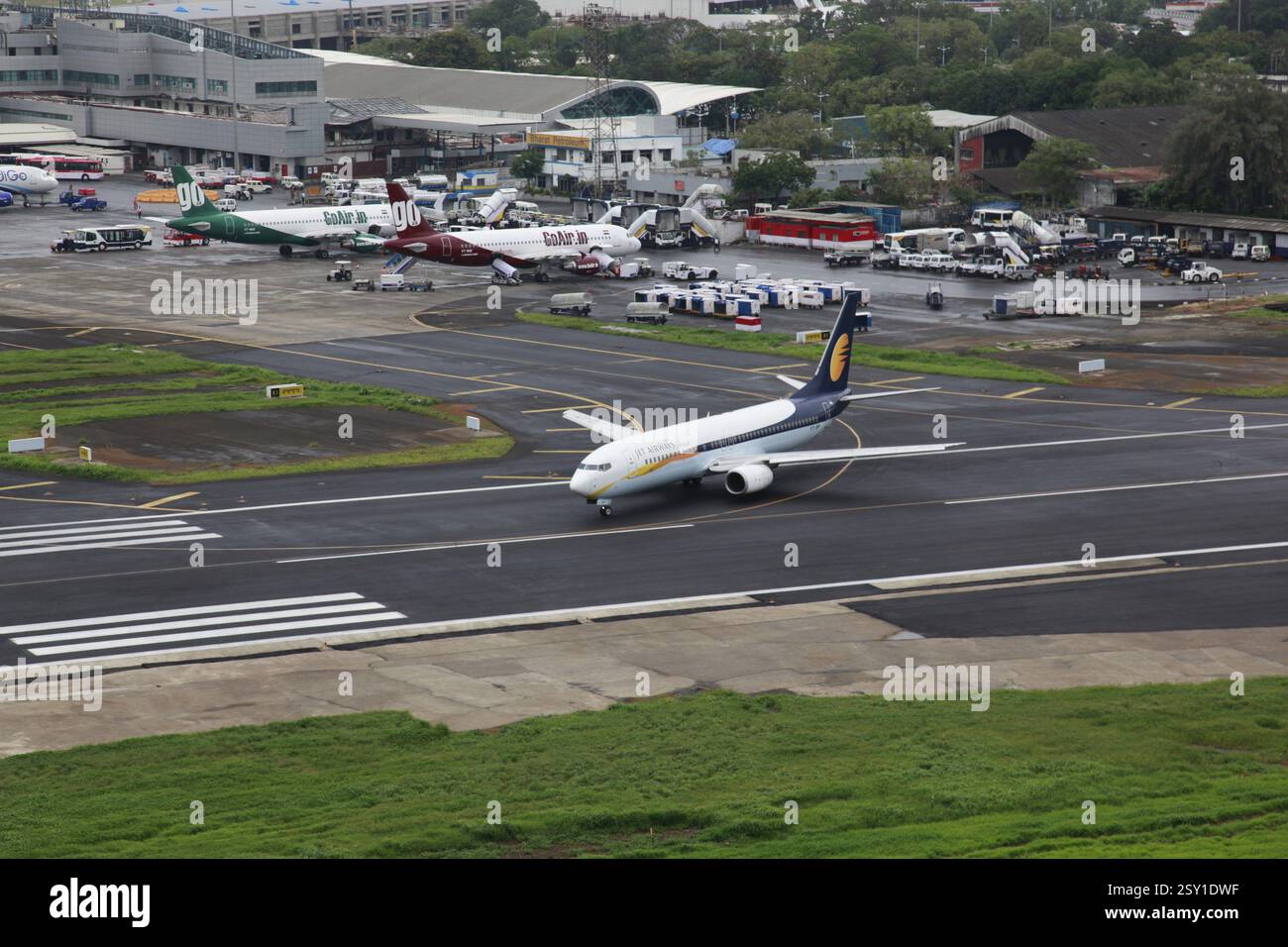 Plane taxing at mumbai airport Stock Photo - Alamy