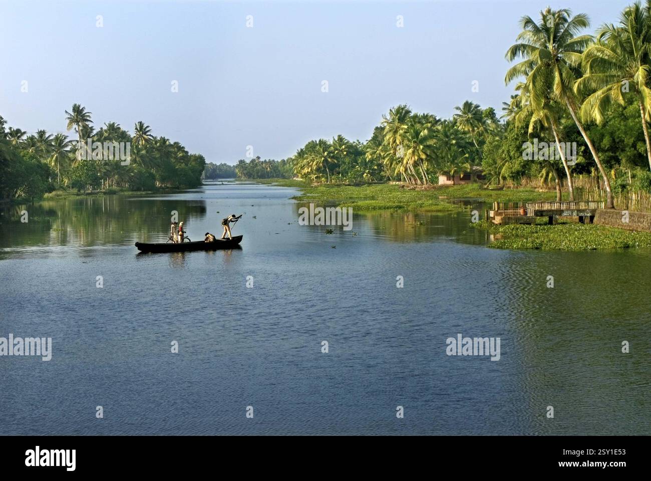People use water transporation using canoe boat at Kollam beach kerala ...