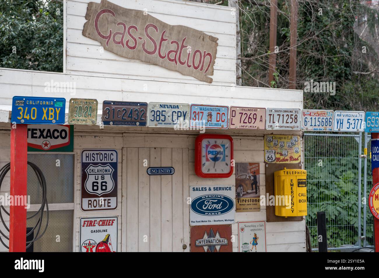 Nostalgic gas station showcasing vintage license plates and retro ...
