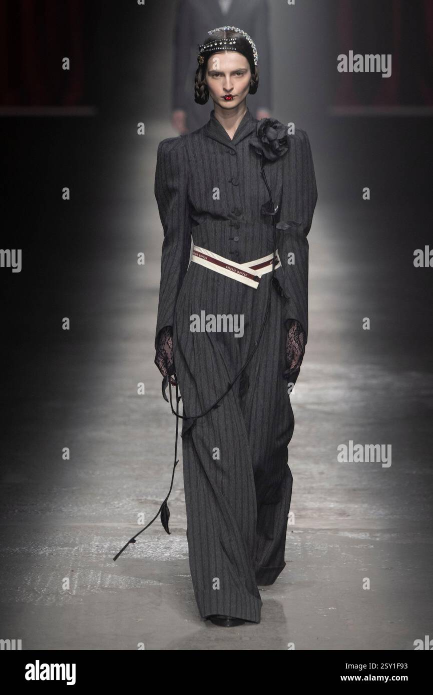 Milan, Italy. 26th Feb, 2025. A model walks on the runway during the ...