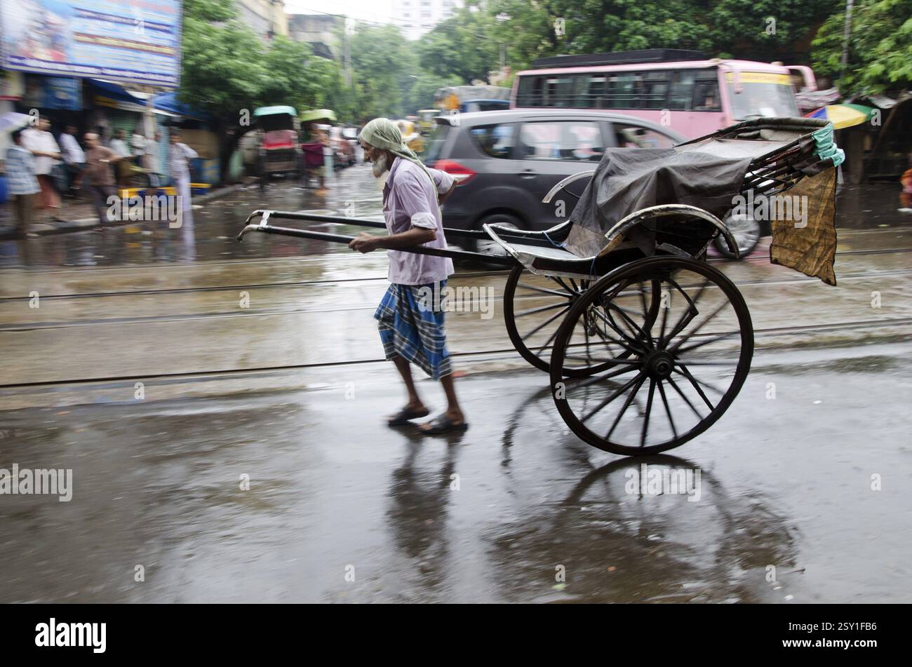 Man pulling Hand Rickshaw on street in Kolkata at West Bengal India ...