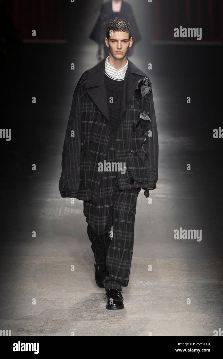 Milan, Italy. 26th Feb, 2025. A model walks on the runway during the ...