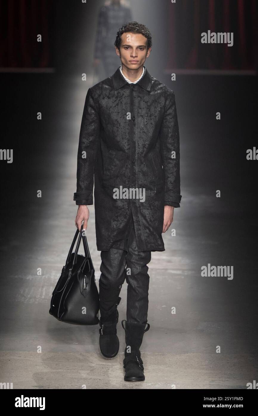 Milan, Italy. 26th Feb, 2025. A model walks on the runway during the ...