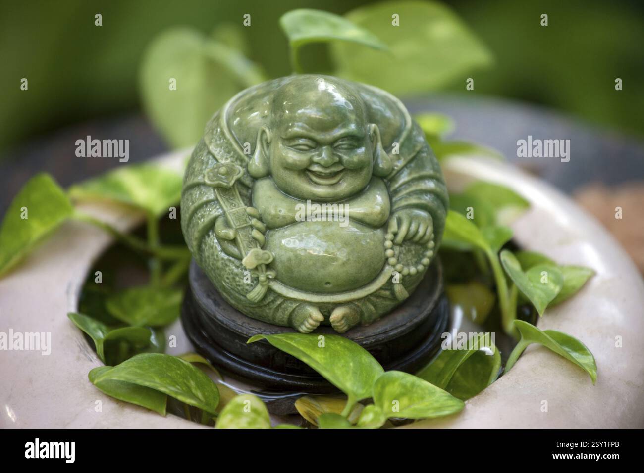 Laughing buddha monk statue India Asia Stock Photo - Alamy