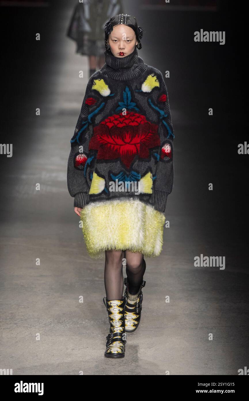 Milan, Italy. 26th Feb, 2025. A model walks on the runway during the ...