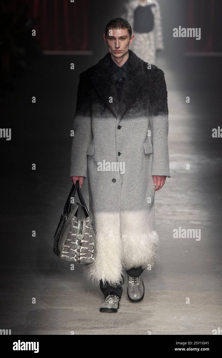 Milan, Italy. 26th Feb, 2025. A model walks on the runway during the ...