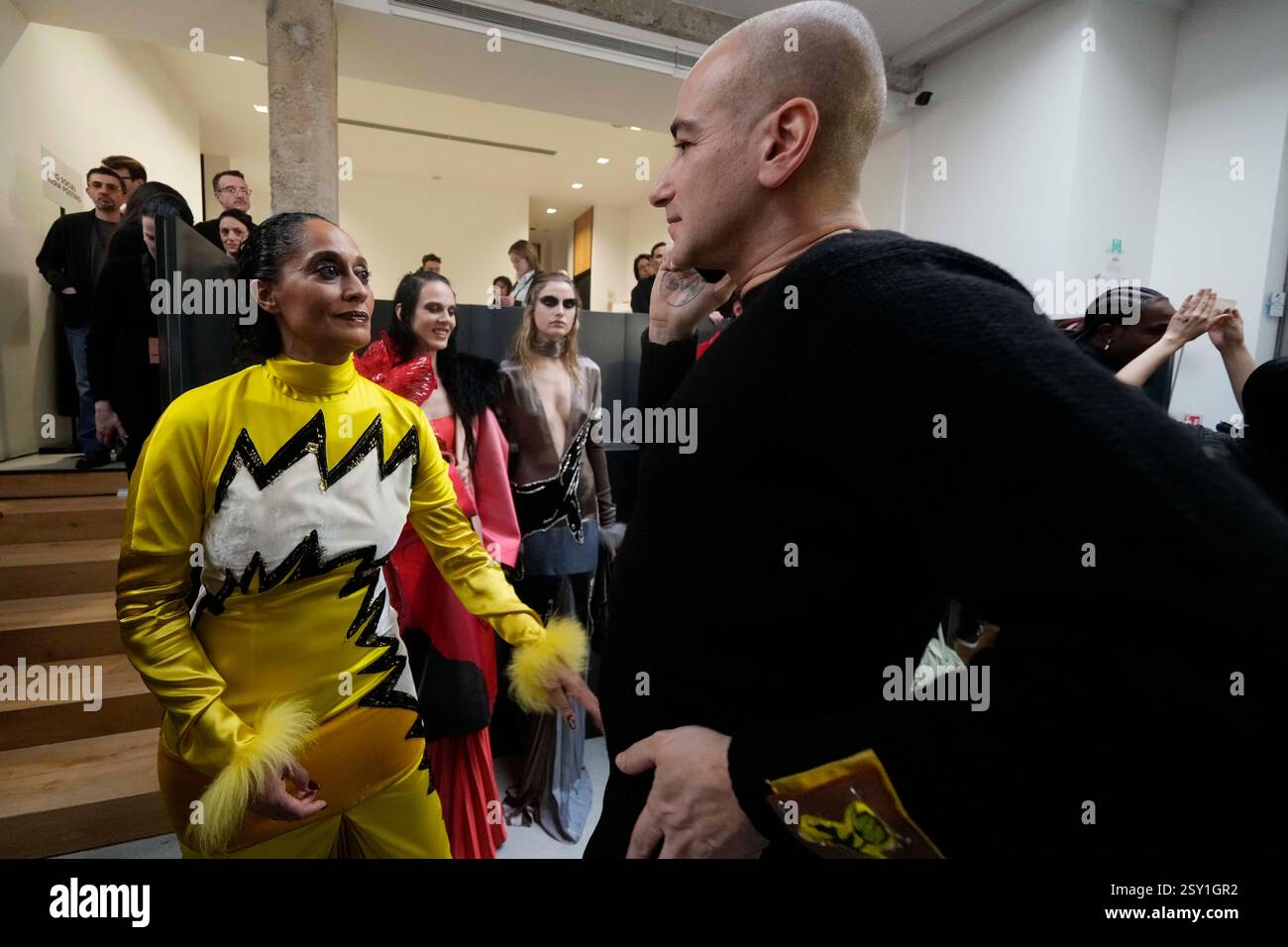 Fashion designer Francesco Risso talks with actress Tracee Ellis Ross ...