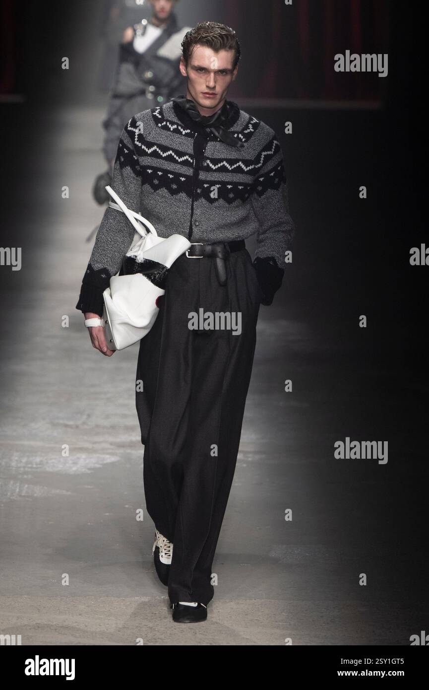 Milan, Italy. 26th Feb, 2025. A model walks on the runway during the ...