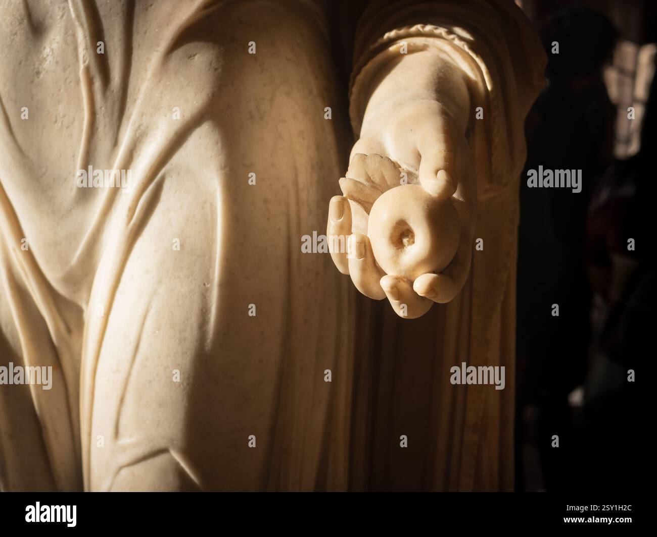 Detail of the elegantly carved hand holding the apple of the Venus ...