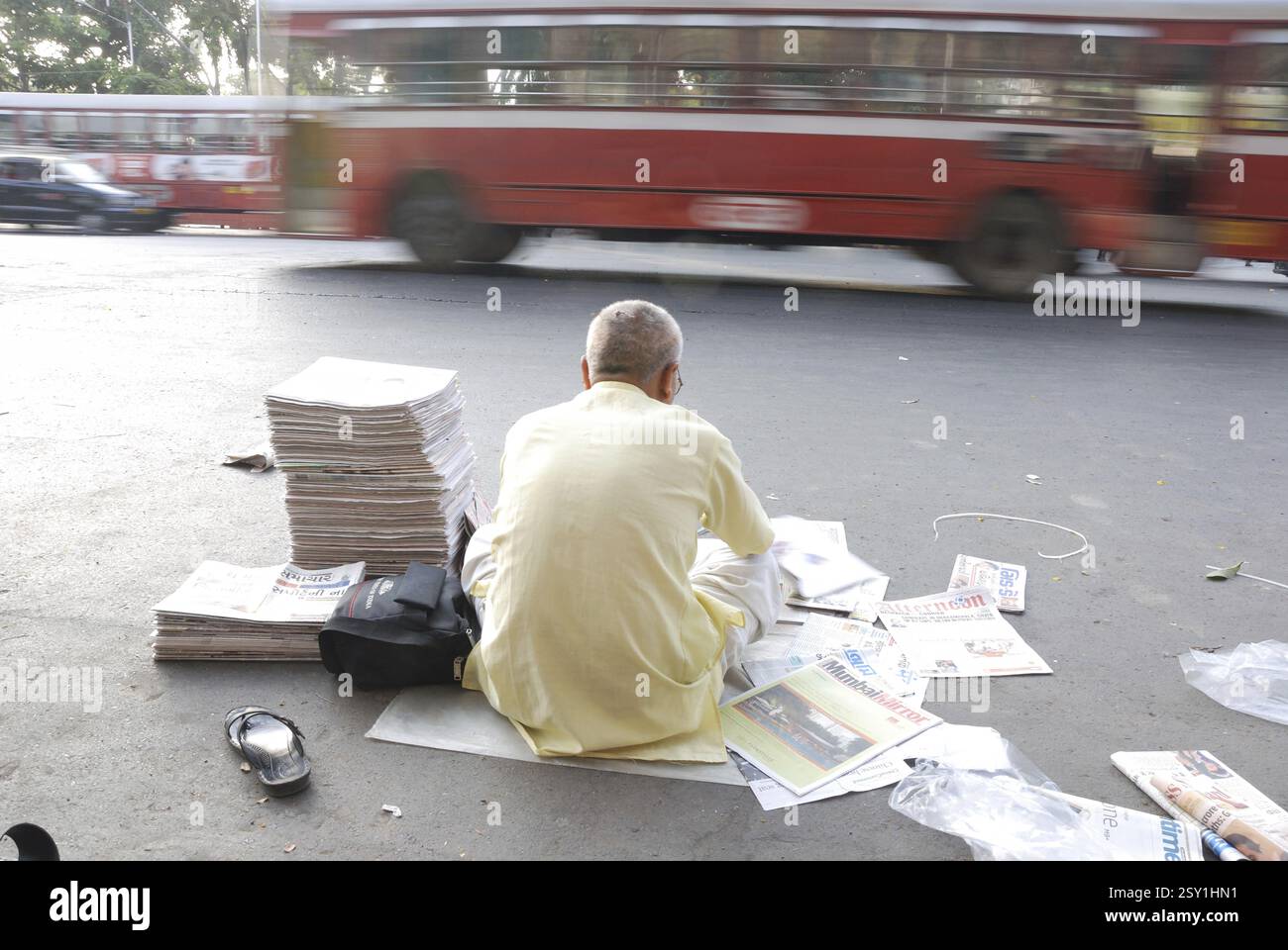 Newspaper vendor sitting on road, mumbai, maharashtra, india, asia ...
