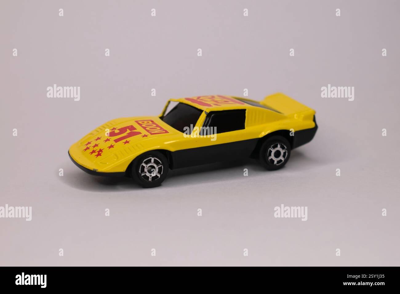 Yellow race car with number 51 isolated on white background with copy ...