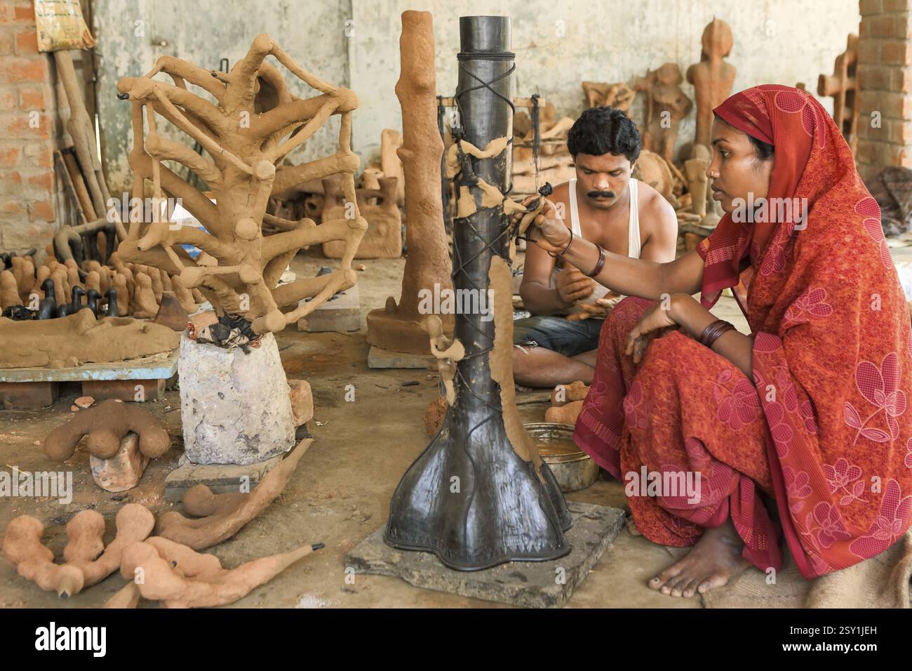Wax model of human figure being covered with clay, bastar, chhattisgarh ...