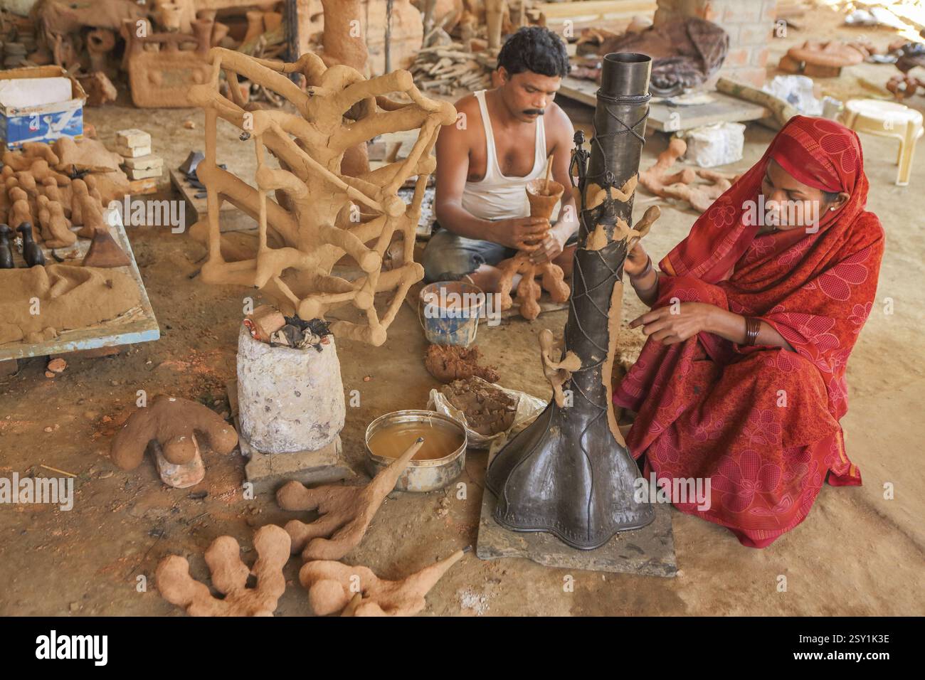 Wax model of human figure being covered with clay, bastar, chhattisgarh ...