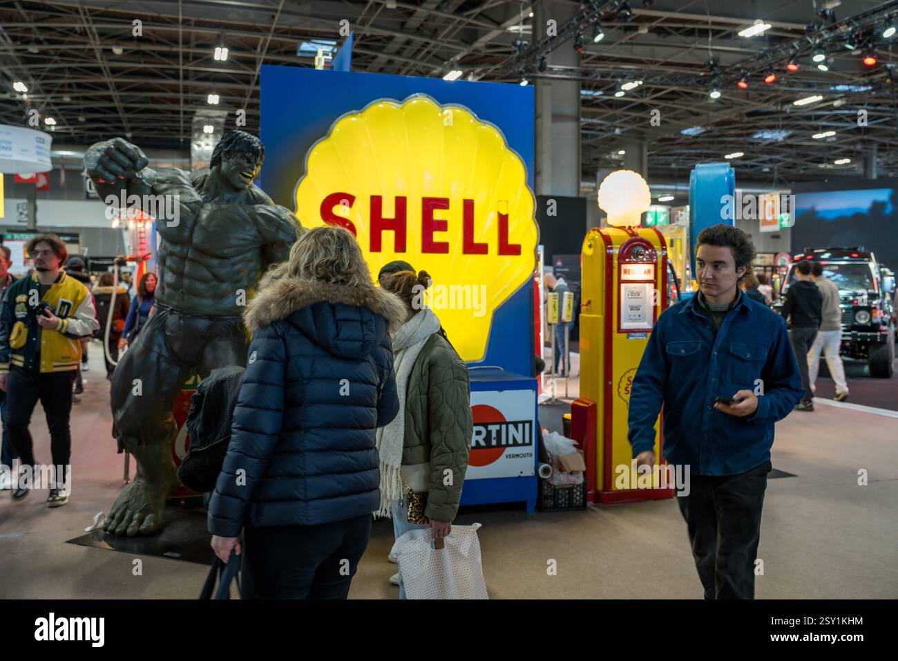 Visitors interact with vibrant displays featuring iconic characters and ...