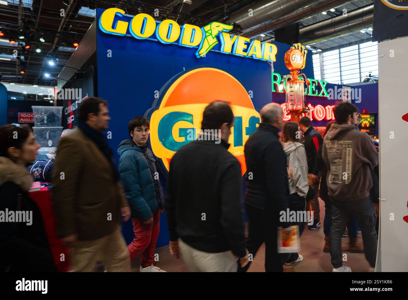 Visitors exploring a vibrant exhibition showcasing unique attractions ...