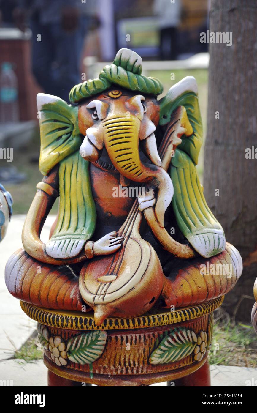 Lord ganesh playing musical instrument sitar, west bengal, india, asia ...