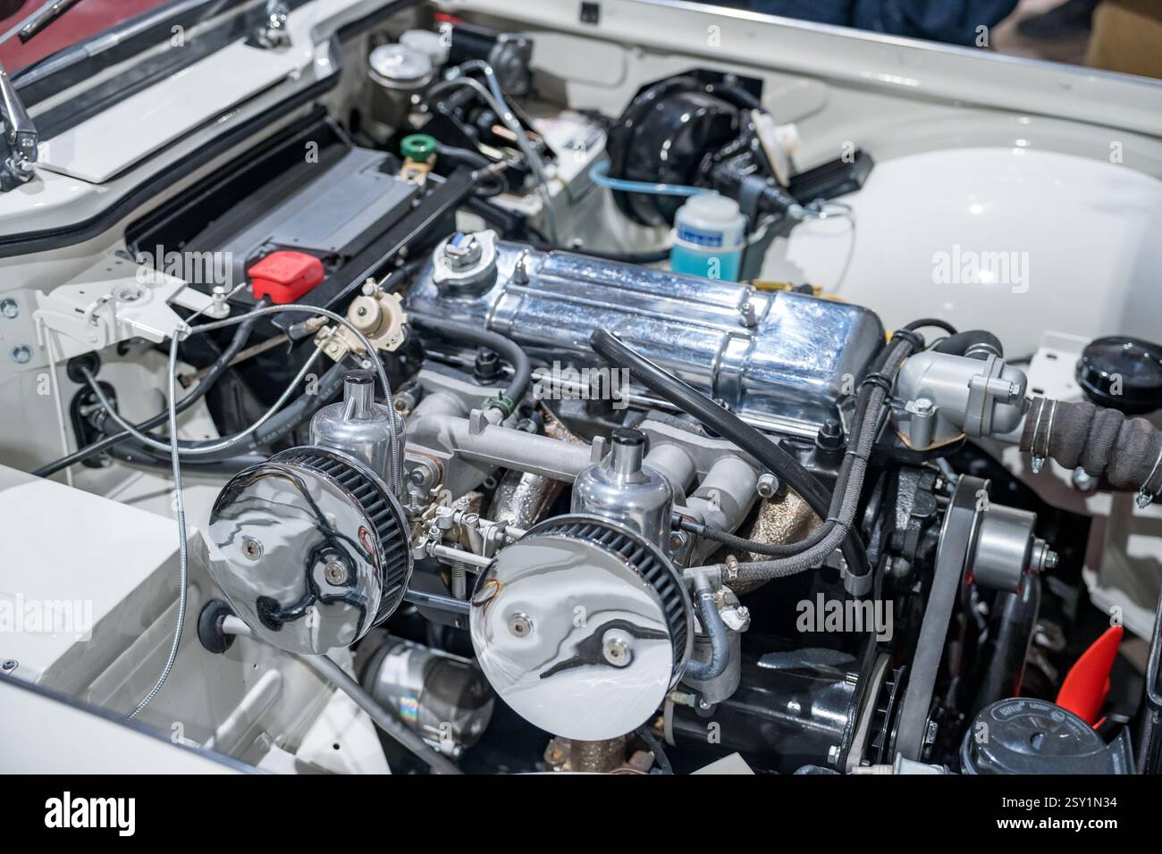 Vintage car engine showcases classic engineering at an auto show event ...