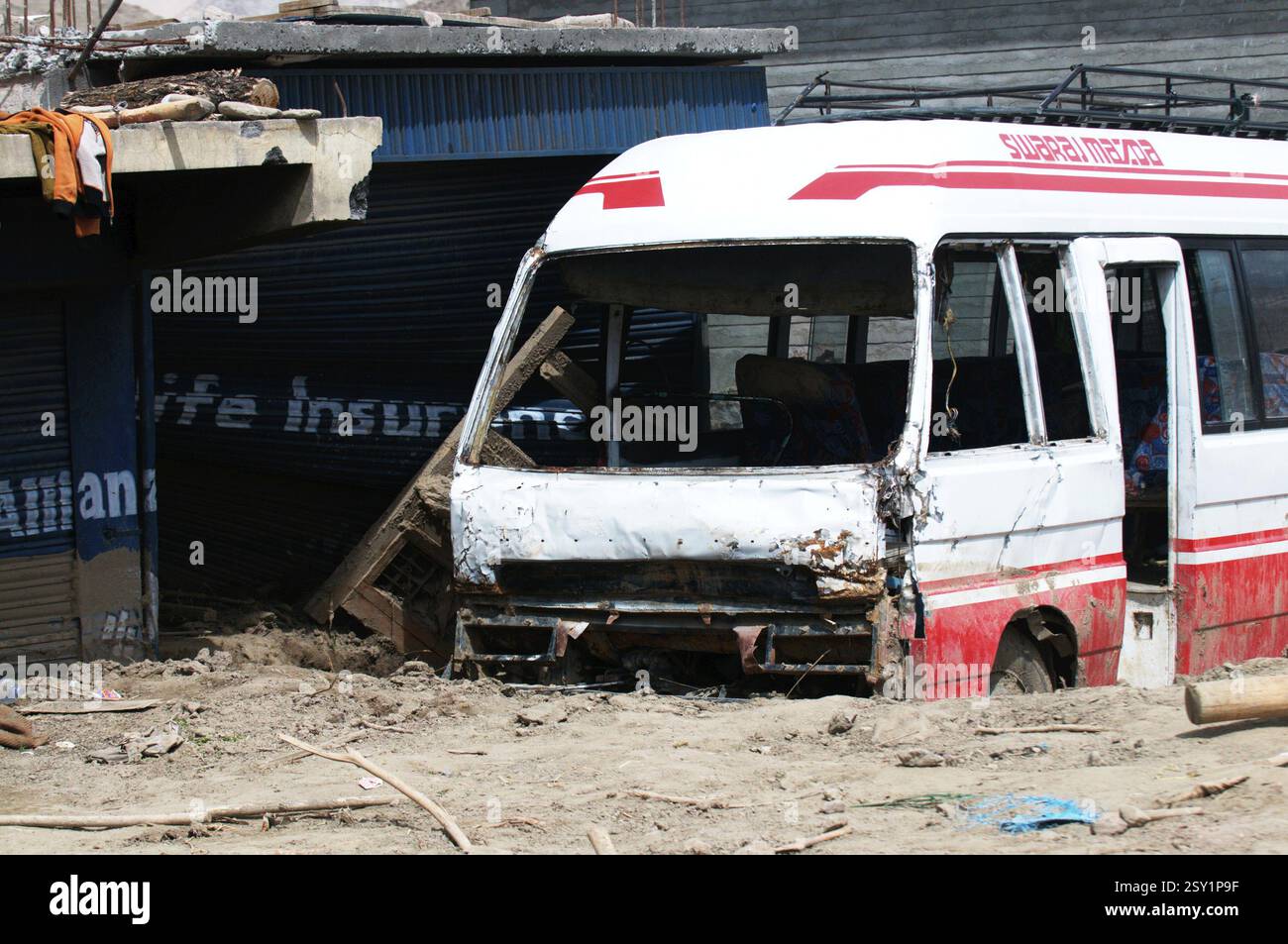 Damaged bus stuck in mud at choglamsar due to flashflood, Leh, Ladakh ...