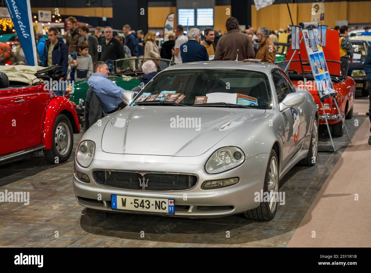 Silver sports car displayed at a historic automobile expo in the city ...