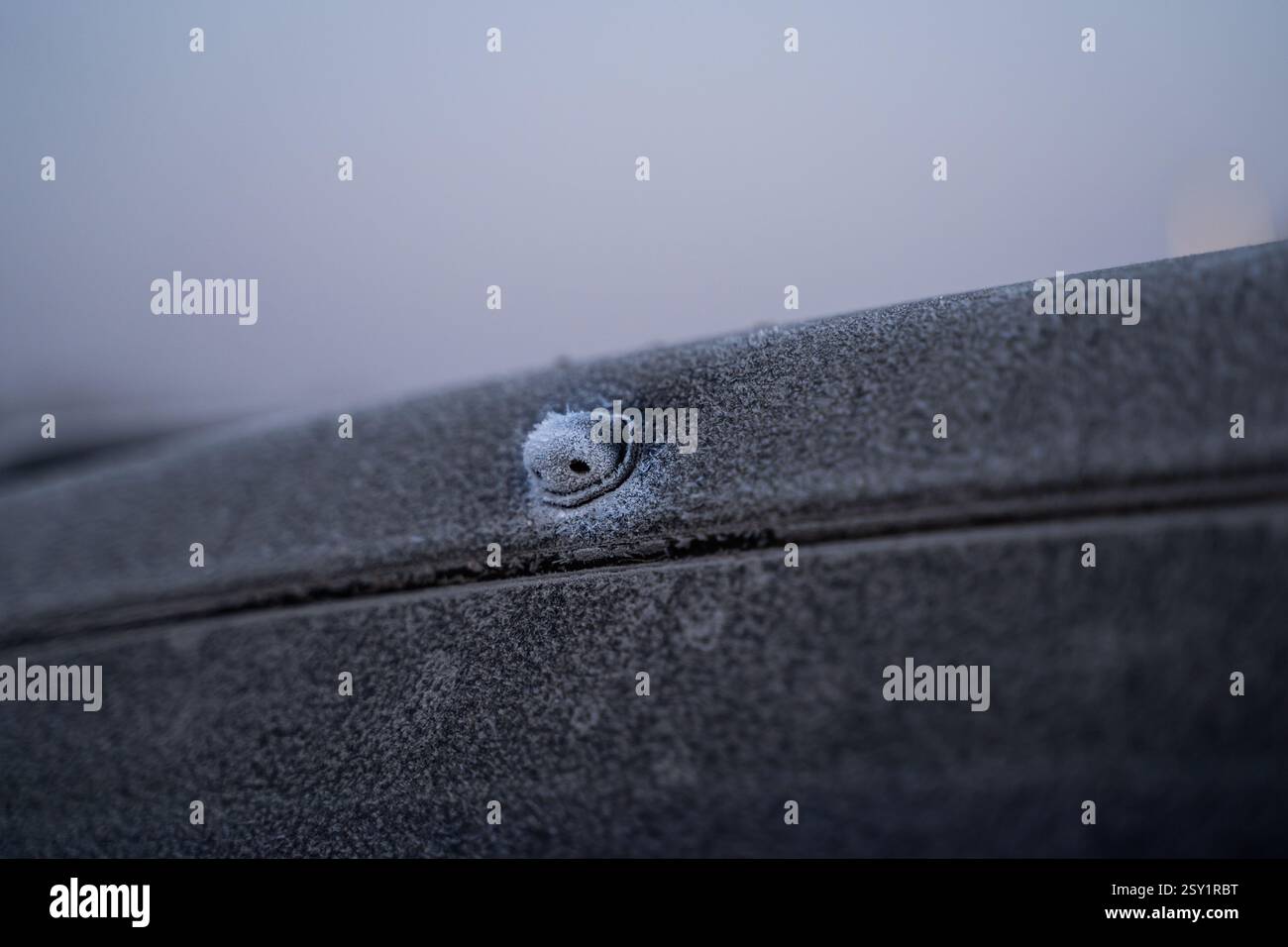 Frozen rear window washer nozzle of a car in winter, close-up Stock ...